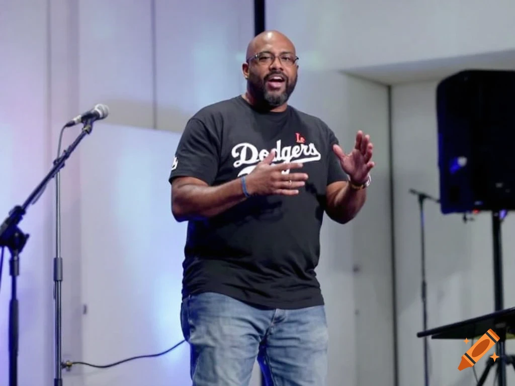 Pastor Dudley Rutherford preaching on a stage in an LA Dodgers shirt ...