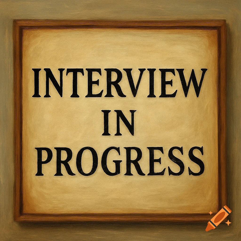 A painted sign in a wooden frame that reads 'INTERVIEW IN PROGRESS'. on ...
